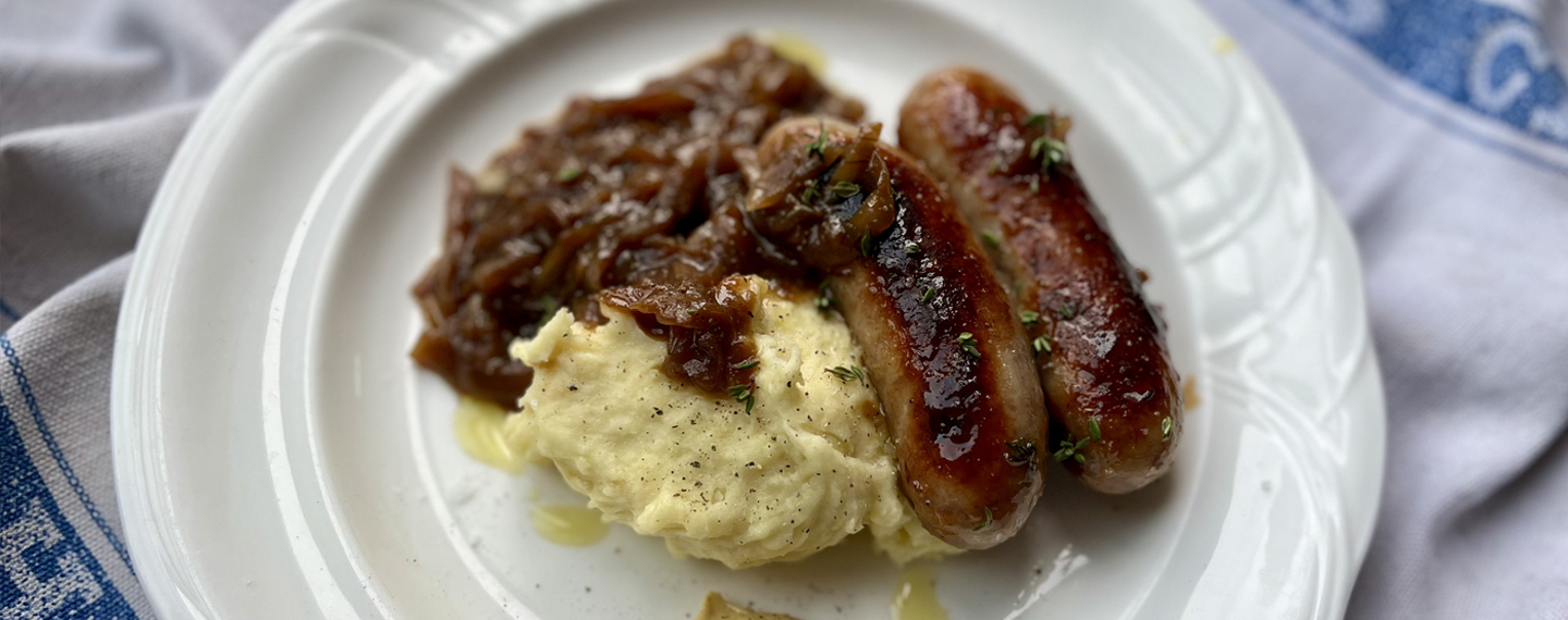 Sausage and mash with smoky onion gravy - Halen Môn